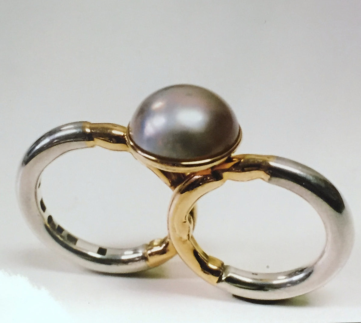 From the 1993 Illusions exhibition. A two finger ring with a pearl ...